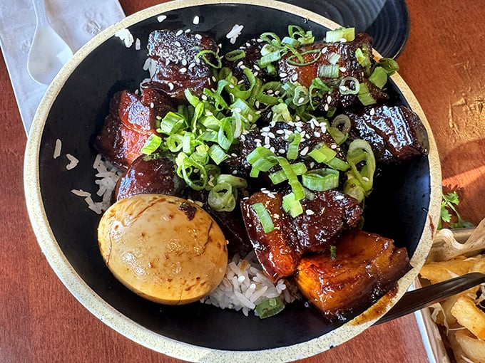 Red-braised pork belly so tender it surrenders at the mere suggestion of your chopsticks. That glistening sauce deserves its own fan club.