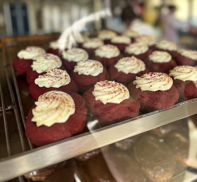 Red velvet donuts topped with cream cheese frosting – proof that sometimes the best things in life come in crimson packages.