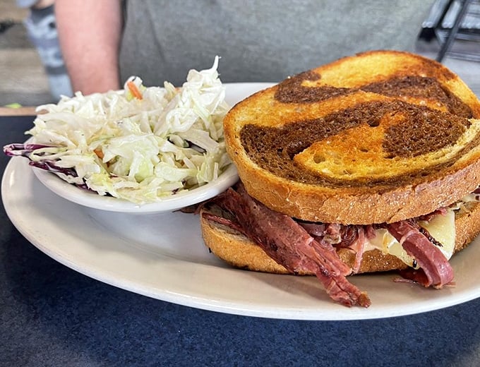 The Reuben sandwich—where corned beef, sauerkraut, and melted cheese create that perfect harmony that makes you close your eyes with each bite.