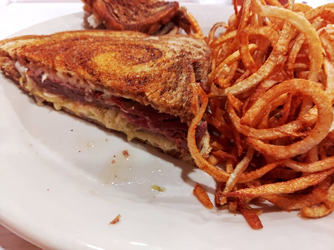 A grilled sandwich with crispy, curly onion rings that makes you wonder why you'd ever waste calories on fast food again.