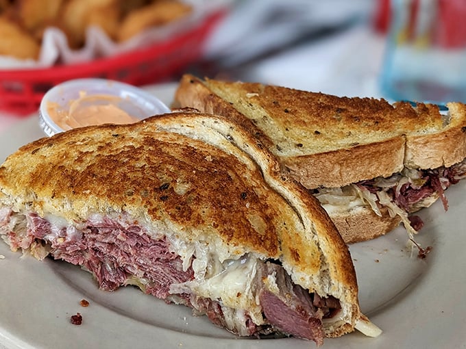 The Reuben sandwich—where corned beef meets sauerkraut in a dance as old as time. This isn't lunch; it's a religious experience between bread.