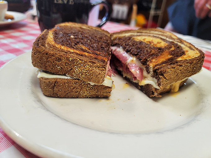 The Reuben sandwich—where toasty rye bread, melted cheese, and tender corned beef come together in perfect harmony. A diner classic done right.