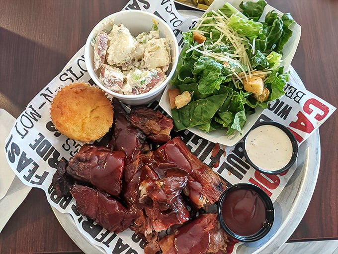 A barbecue plate that doesn't need Instagram filters—just napkins. That cornbread and potato salad aren't mere sides; they're supporting actors in a meaty drama.