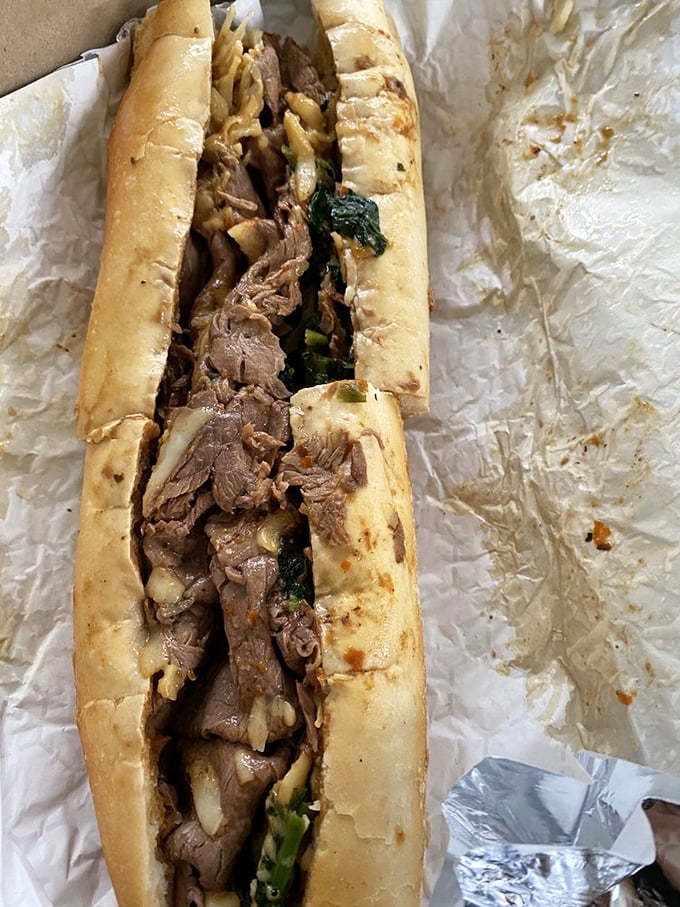 Roast beef and greens nestled in a crusty roll—proof that sometimes the simplest combinations yield the most profound satisfaction.