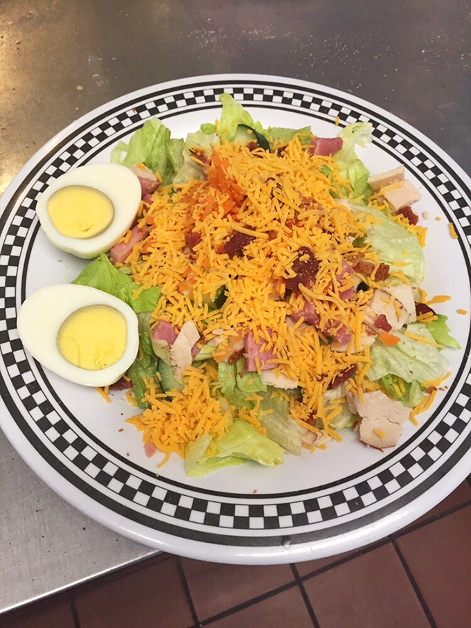 A chef's salad that doesn't skimp on the good stuff—where the cheese-to-green ratio respects the American diner tradition.