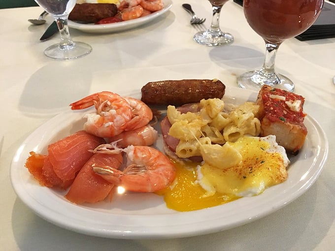 A plate that's having an identity crisis in the best way—part breakfast, part seafood feast, all delicious with those plump, pink shrimp.