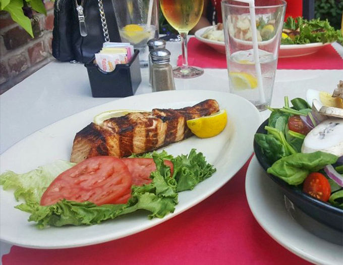 Not all heroes wear capes—some come perfectly grilled with a lemon wedge, proving Tessaro's mastery extends beyond the burger universe.