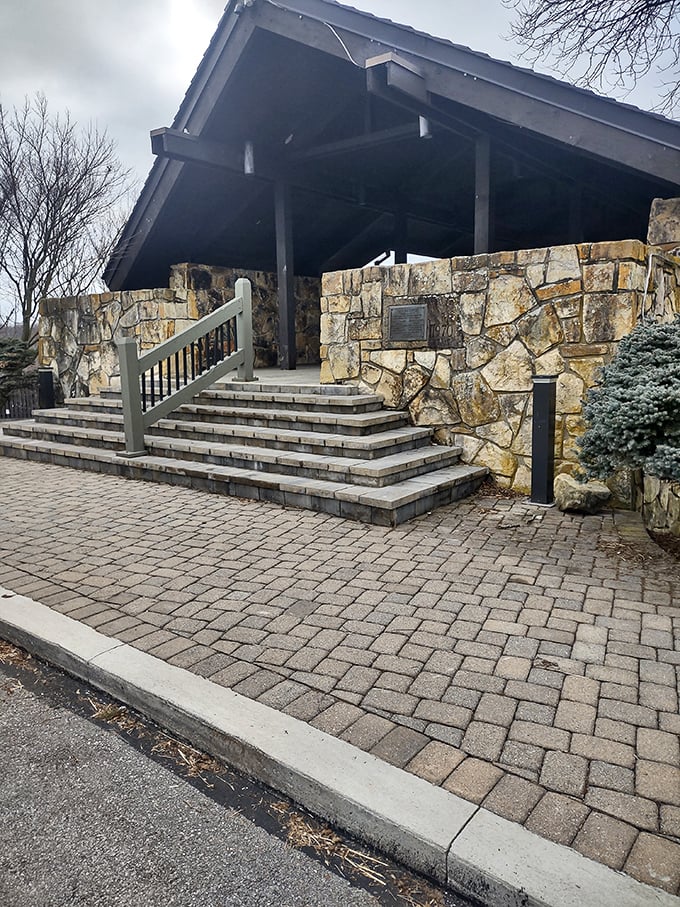 The park's stone entrance pavilion welcomes visitors like a rustic red carpet, minus the paparazzi and uncomfortable shoes.