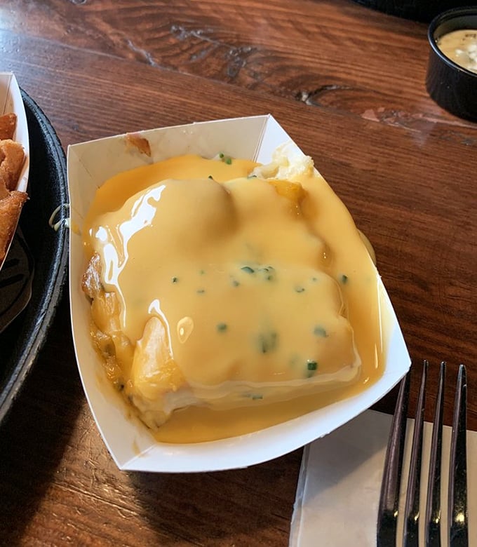 Golden scalloped potatoes drowning in cheese sauce – the side dish that threatens to steal the entire show.