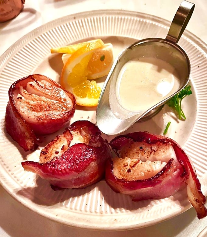 Bacon-wrapped scallops: proof that sometimes the best relationships are the simplest ones, wrapped in pork and sealed with fire.