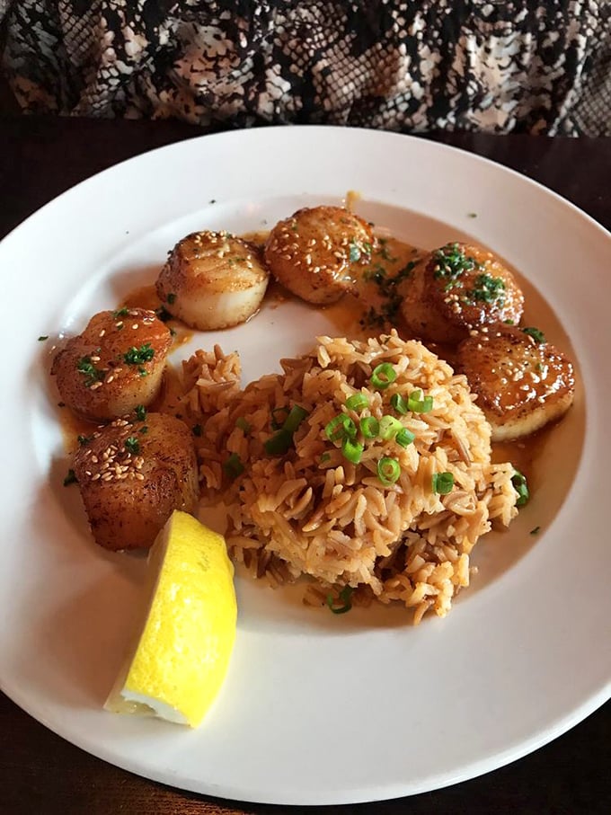 Scallops that would make Neptune himself weep with joy. Perfectly seared medallions of oceanic butter, proving simplicity is the ultimate sophistication.