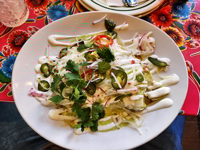 This isn't just a plate of food—it's an edible color palette where creamy white sauce meets vibrant greens and reds in perfect harmony.