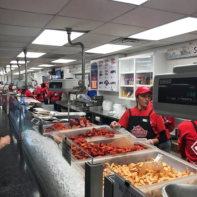 The staff in their signature red shirts orchestrate a symphony of seafood. Those crawfish are calling my name!