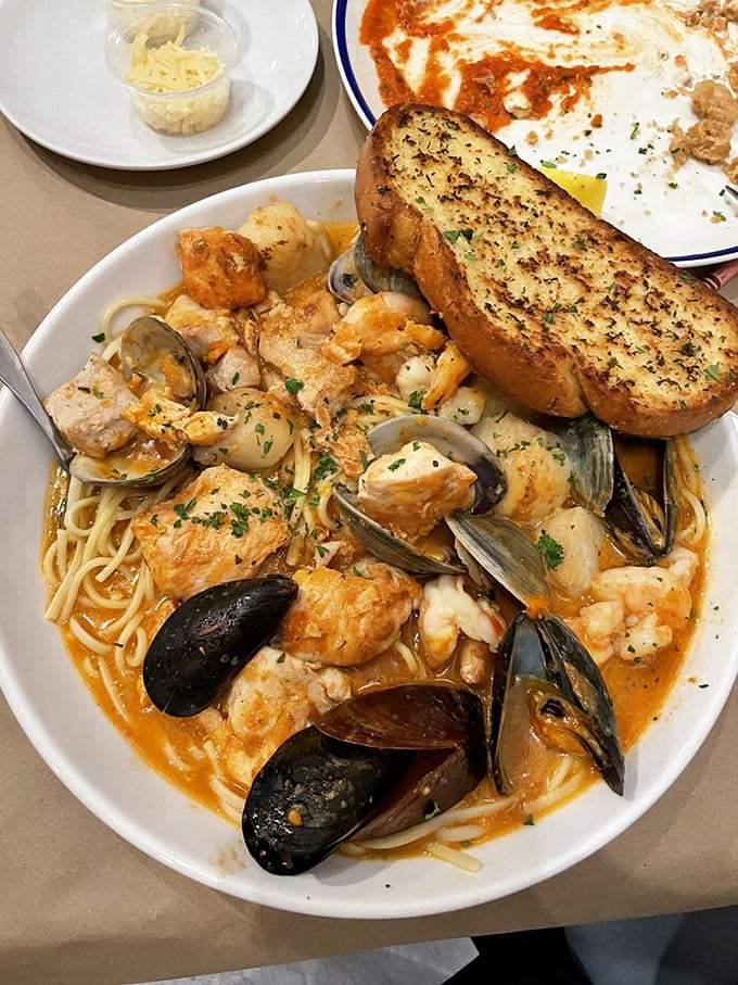 This seafood pasta masterpiece combines linguine with ocean treasures in a bowl that screams "coastal comfort food."