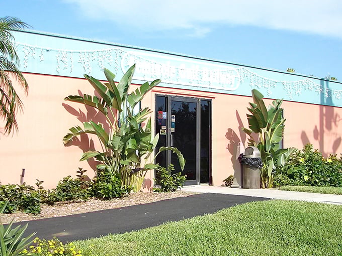 The salmon-colored station with its tropical landscaping screams "Florida!" louder than a retiree who's just spotted an alligator on the golf course.