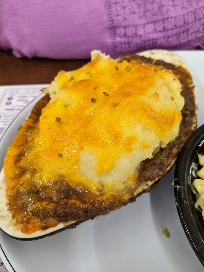 This isn't your cafeteria shepherd's pie – it's a golden-topped comfort bomb with cheese that stretches like it's auditioning for a pizza commercial.