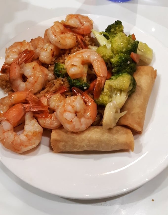 Plump, perfectly cooked shrimp nestled alongside crisp broccoli and golden egg rolls—a plate that proves buffets can deliver quality and quantity.