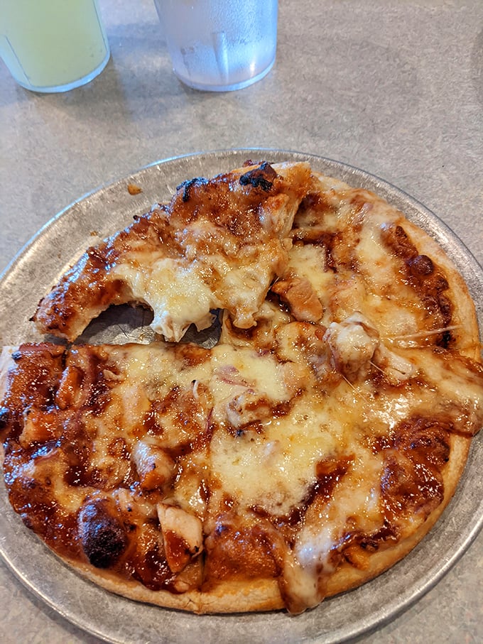 BBQ chicken pizza with that signature swirl of sauce on top—breaking pizza rules in all the right ways.
