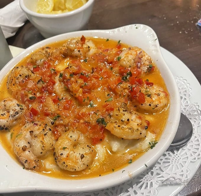 These shrimp and grits aren't just a dish – they're the South's greatest culinary achievement swimming in a sauce worth bottling.