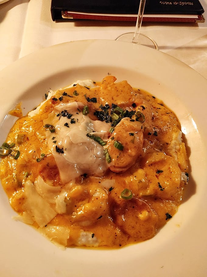 Shrimp and grits elevated to an art form—creamy, cheesy, and rich enough to make you consider relocating to the South permanently.