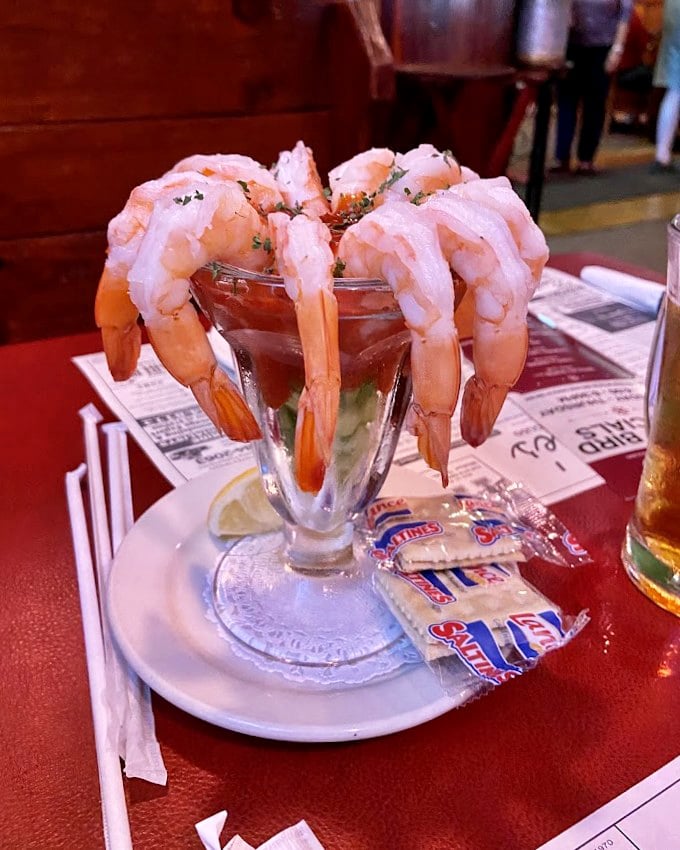 The shrimp cocktail – where each plump crustacean hangs off the glass like it's showing off. Ocean-fresh flavor that makes you forget you're in landlocked Ohio.