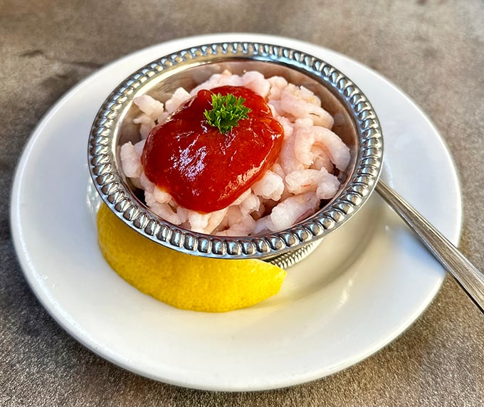 The shrimp cocktail arrives like tiny treasures in a silver chalice. A refreshing prelude to the meat marathon ahead.