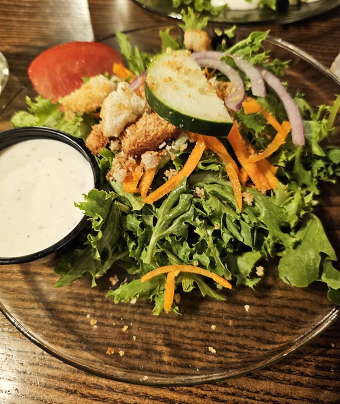 A salad that knows its role—fresh, crisp supporting actor to the steakhouse stars, with house-made dressing that deserves its own billing.