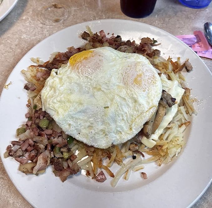The breakfast skillet – where hash browns, meat, veggies, and eggs unite in perfect harmony. It's the breakfast equivalent of The Beatles getting back together.