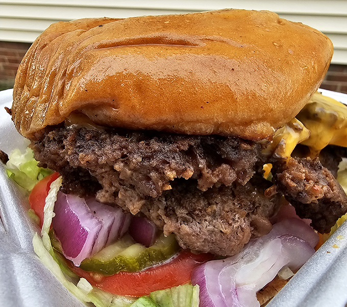 A smashburger so perfectly constructed it could solve engineering problems. That bun-to-meat ratio deserves a Nobel Prize in deliciousness.
