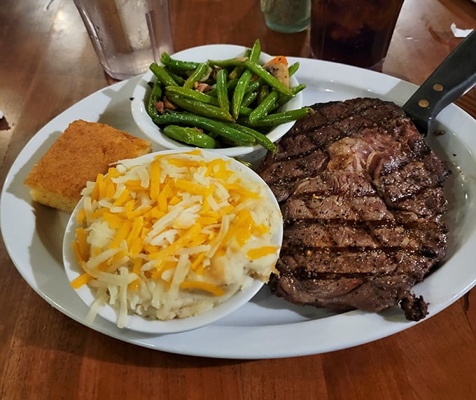 This ribeye isn't just dinner—it's performance art. The smoke ring tells a story of patience, while those cheesy potatoes whisper sweet nothings to your taste buds. 