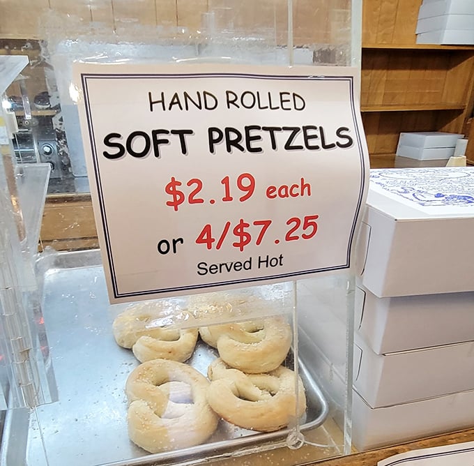 Hand-rolled soft pretzels sit ready to deliver that warm, doughy comfort you never knew you needed.