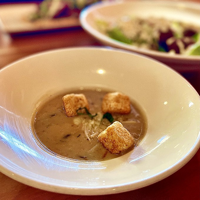 This mushroom soup isn't just a starter—it's a revelation in a bowl. Those croutons are like little life rafts in a sea of earthy goodness.