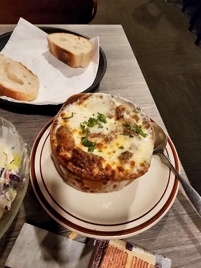French onion soup that's worth the inevitable cheese pull photo-op. Bubbling cheese meets savory broth in this classic supper club starter.