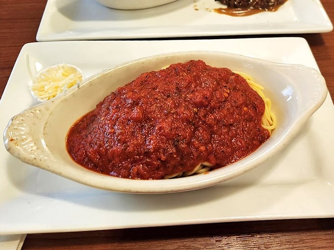 Spaghetti with meat sauce that doesn't mess around—this isn't some dainty portion, it's a proper Ohio-sized serving of Italian-American comfort.
