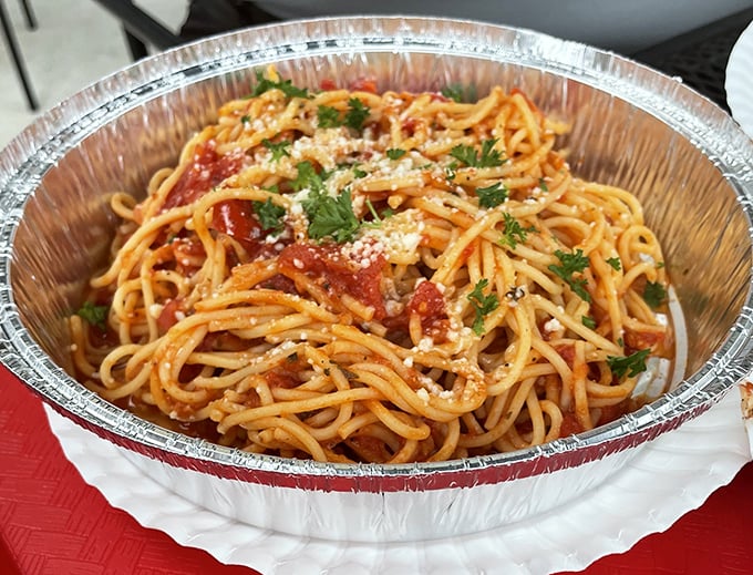 Spaghetti that proves simplicity is the ultimate sophistication. That dusting of parmesan and fresh herbs isn't just garnish—it's the crown jewels.