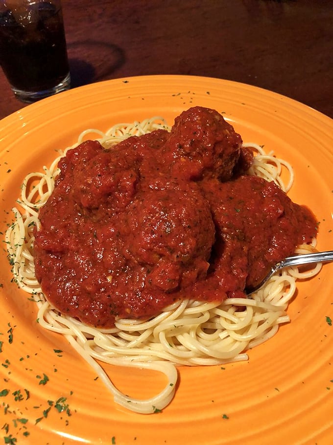 These meatballs aren't just big; they're "call your friends to brag about them" big. Perched atop perfectly cooked spaghetti like edible Mount Rushmores.
