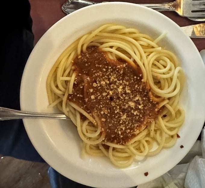 Spaghetti with a hearty sauce and a generous dusting of cheese—proof that even in a steakhouse, pasta deserves its moment in the spotlight.
