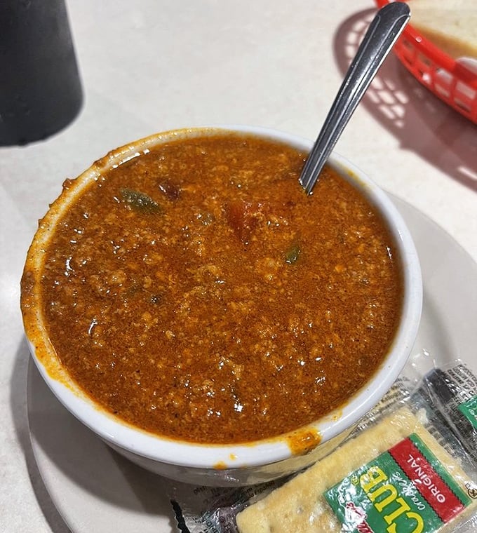 A bowl of chili that means business, with each spoonful delivering a warm hug to your taste buds and a gentle kick to wake them up.