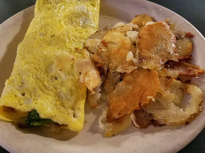 The omelet – fluffy, golden, and substantial enough to fuel you through even the most demanding morning meetings.