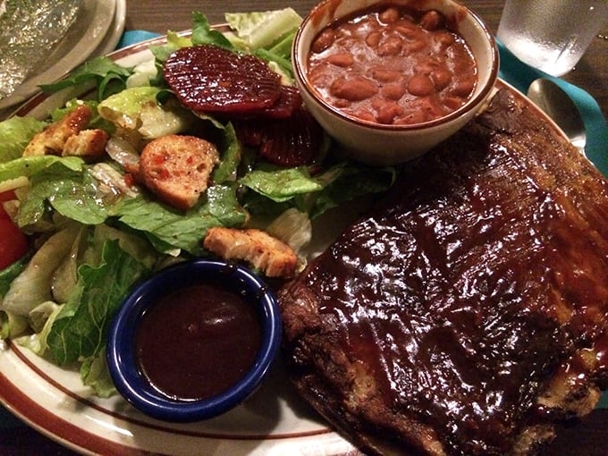 The St. Louis ribs share a plate with a salad that knows its supporting role – present but never upstaging the smoky, tender star of the show.