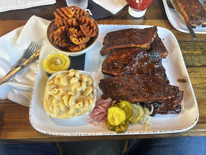 St. Louis ribs with that perfect bark, mac and cheese that's actually cheesy, and sweet potato fries—the holy trinity of barbecue happiness.