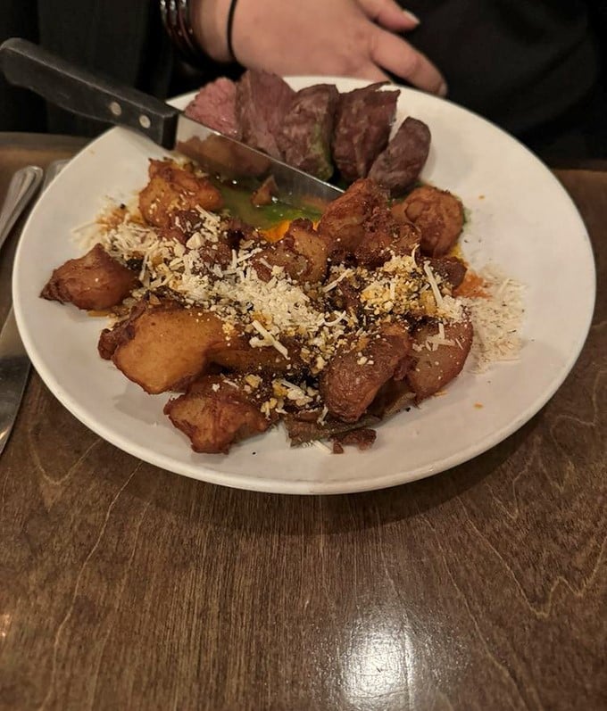 Perfectly seared steak shares the spotlight with crispy potatoes dusted with cotija cheese—proof that simplicity executed flawlessly needs no fancy tricks.