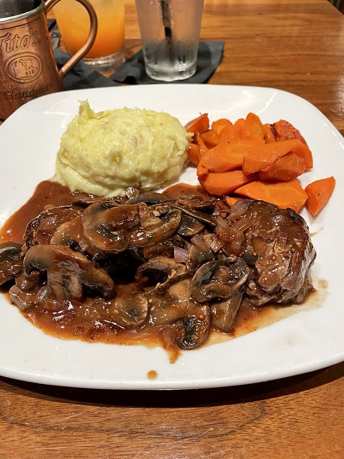 Julia would approve – tender beef swimming in rich Burgundy sauce with mushrooms, proving that comfort food can absolutely be sophisticated.