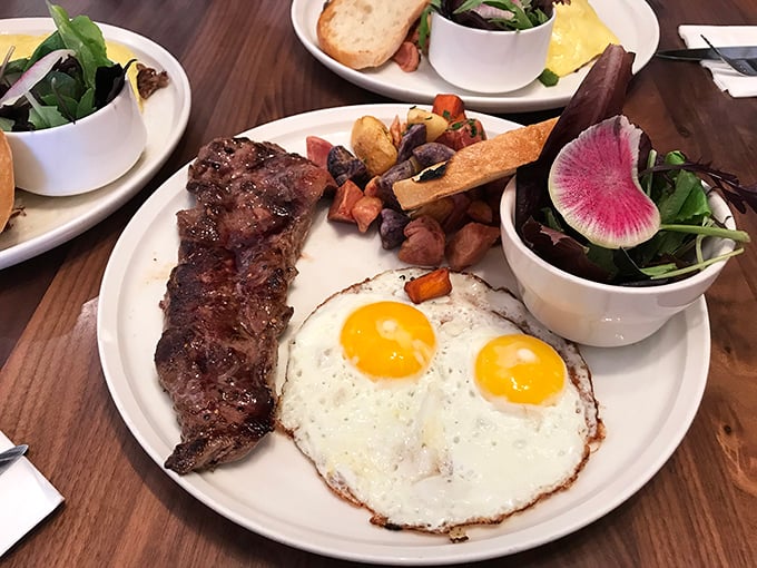 Steak and eggs—the breakfast power couple that never disappoints, with sunny-side up eggs beaming like California sunshine.