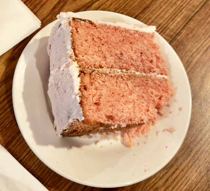 A slice of strawberry cake that doesn't need filters or fancy plating—just fork access and an appreciation for honest baking.