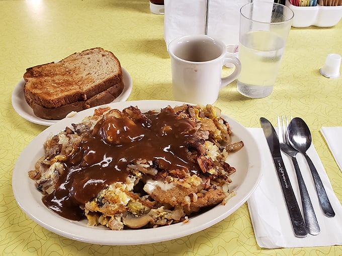 Gravity-defying hash browns smothered in gravy—the kind of breakfast that makes you want to cancel lunch and possibly dinner too.