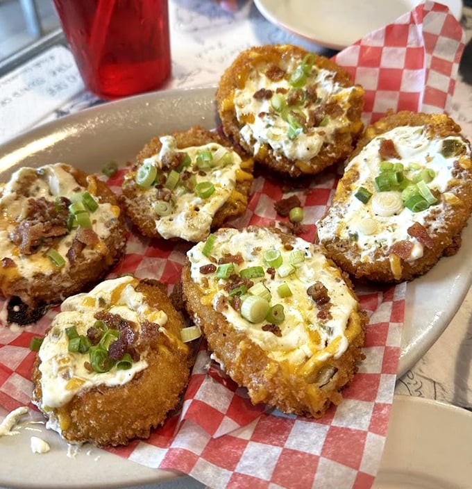 Stuffed onion rings topped with green onions and bacon bits—proof that sometimes the best things in life come in circular form.