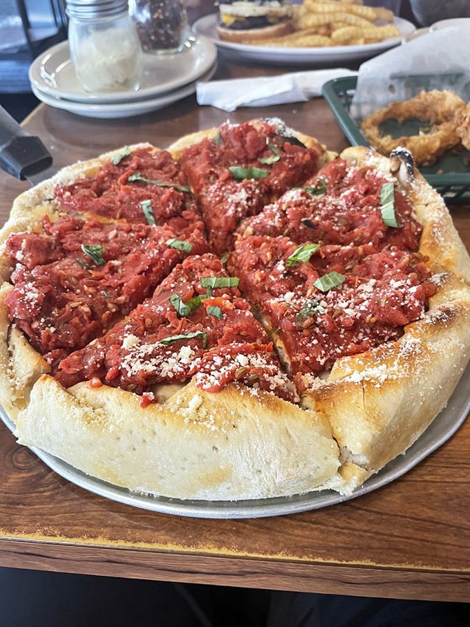 Pizza or art installation? This deep-dish beauty with its chunky sauce and fresh herbs makes a compelling case for both.