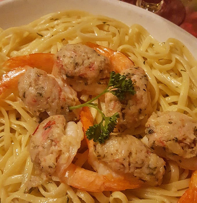 Plump stuffed shrimp lounging on a bed of linguini like they own the place. The garnish isn't just for show – it's saying "Yes, we care about the details."
