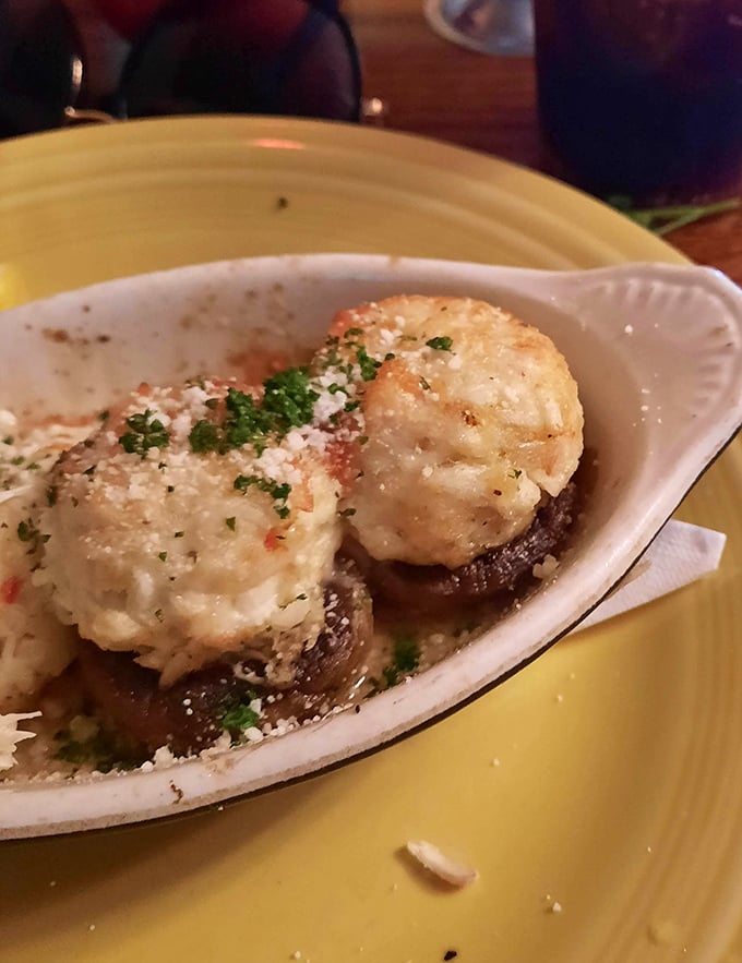 Stuffed mushrooms that could convert even the most dedicated fungus-phobe – little umami bombs topped with what appears to be crab and parmesan.
